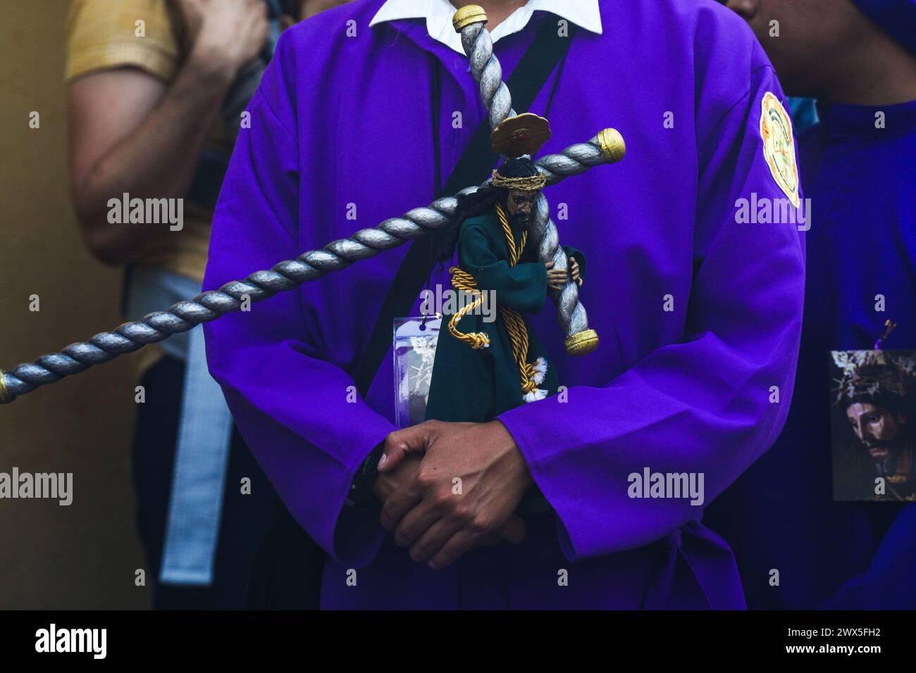 Antigua, Guatemala. 27th Mar, 2024. A penitent holds a statue of Jesus ...