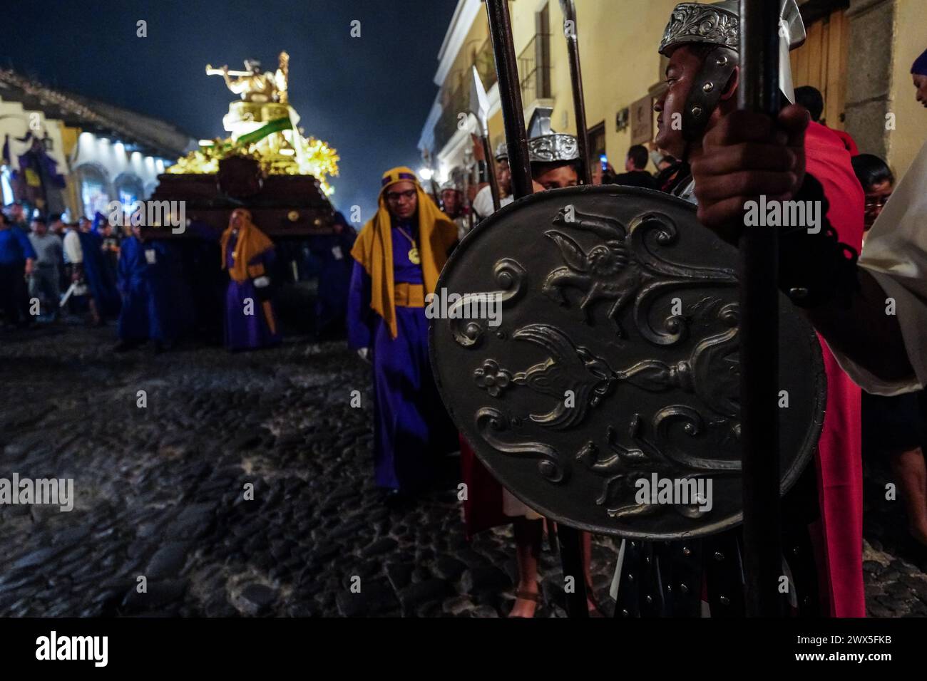 Antigua, Guatemala. 27th Mar, 2024. Costaleros carry the massive Jesús ...