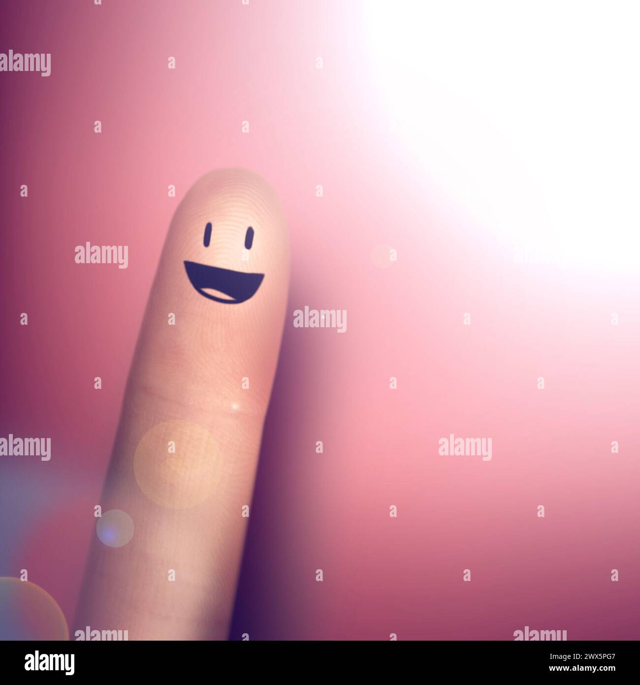 Funny, face drawing and smile on finger in studio isolated on a pink ...