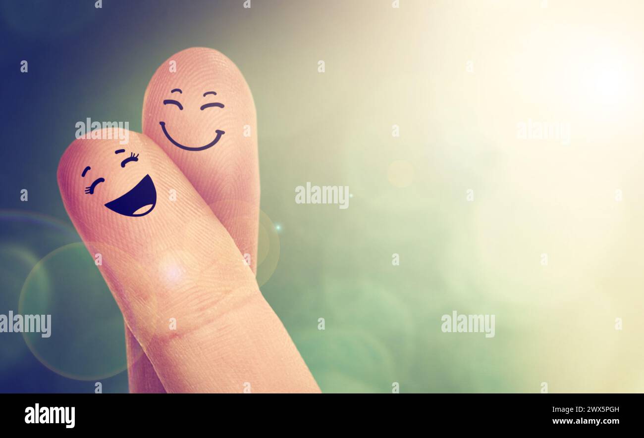 Funny, face drawing and couple of fingers in studio isolated on a ...