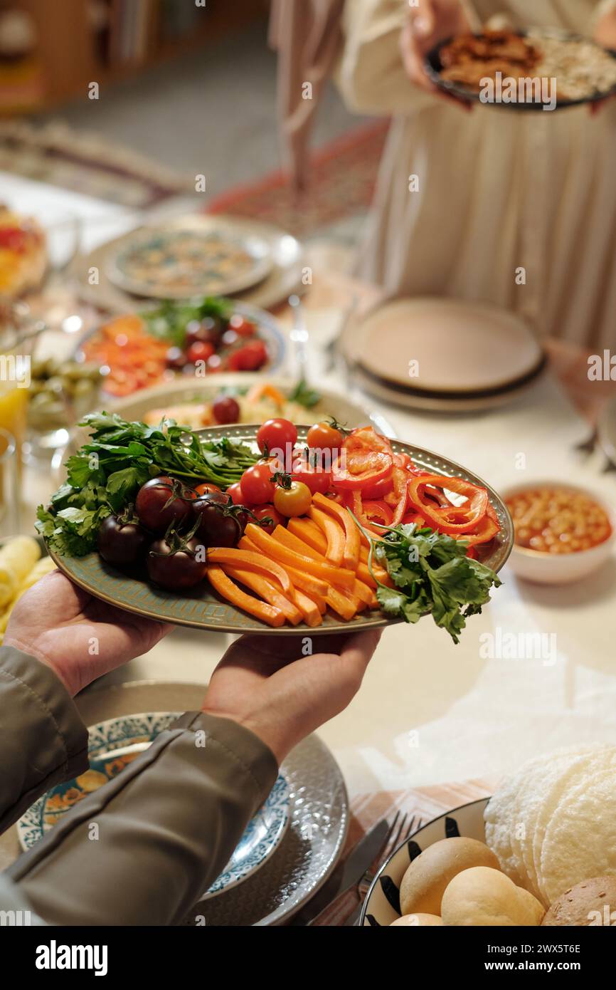 Vertical high angle view shot of hands of unrecognizable Muslim women ...