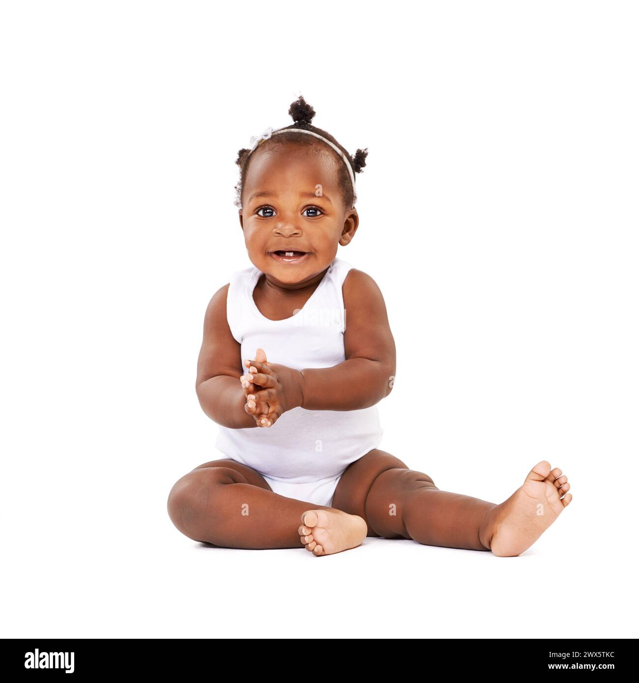 Portrait, baby girl and clapping with smile in studio for applause ...