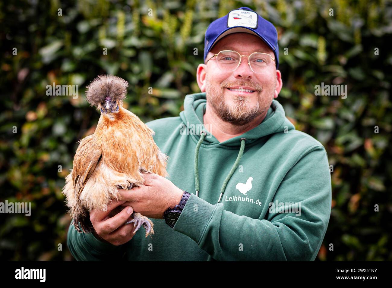 Lehrte, Germany. 26th Mar, 2024. Niko Riggers, who rents out chickens ...
