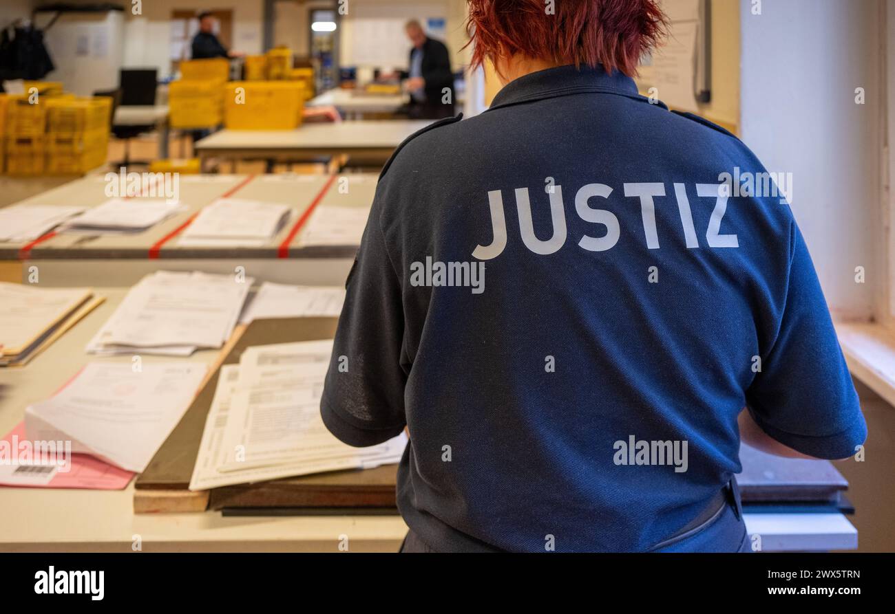 Berlin, Germany. 27th Mar, 2024. A prison officer works in the mailroom ...