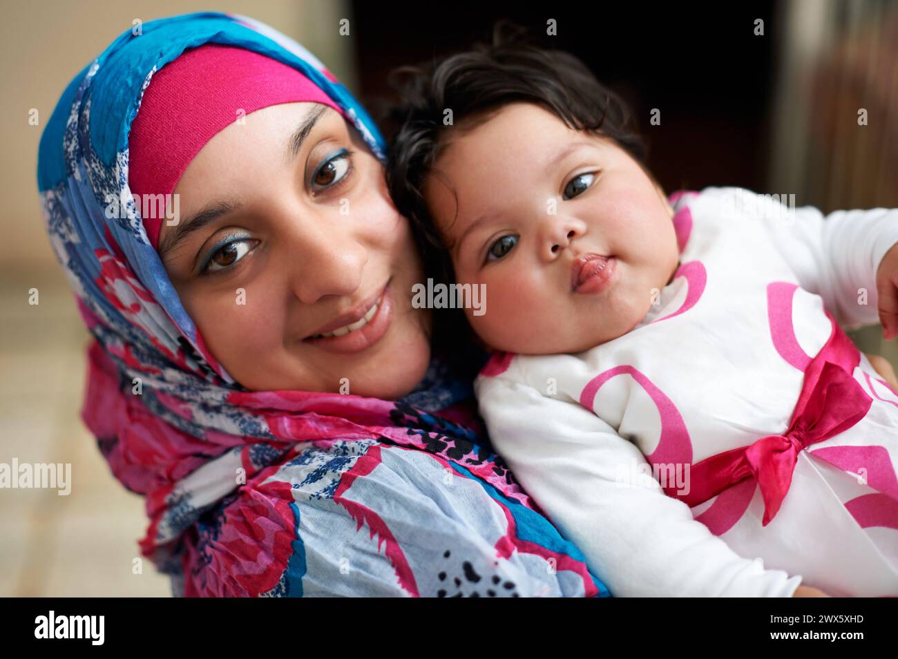 Happy, portrait and muslim mom with baby in home with love and care for ...