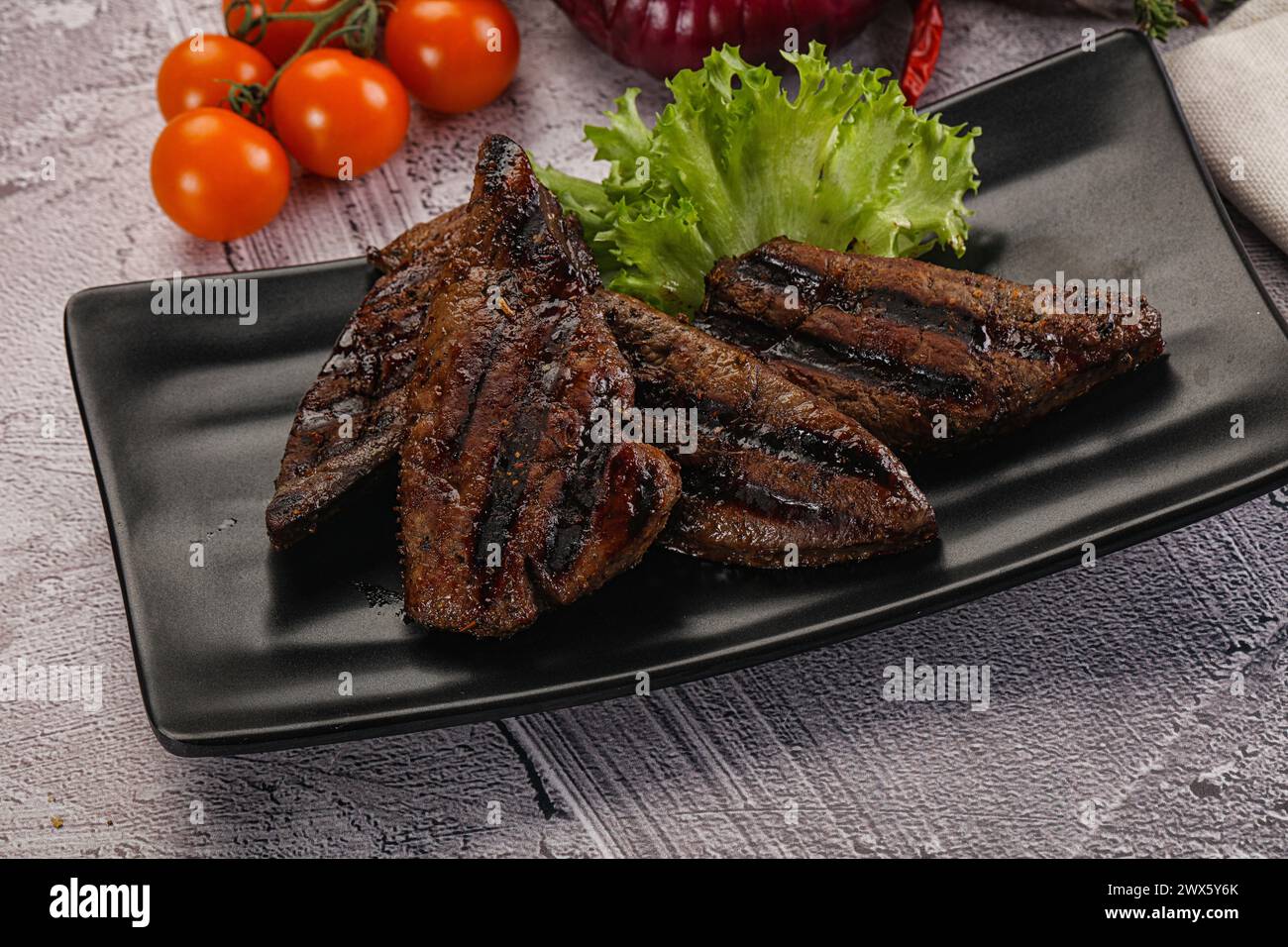 Grilled diet beef liver steak in the plate Stock Photo - Alamy