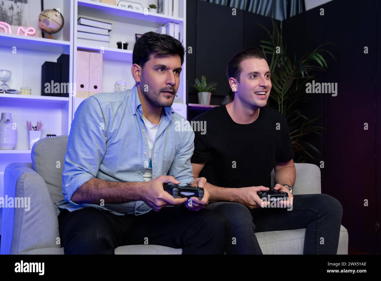 Winner and loser players of buddy friend gamers playing video game on ...