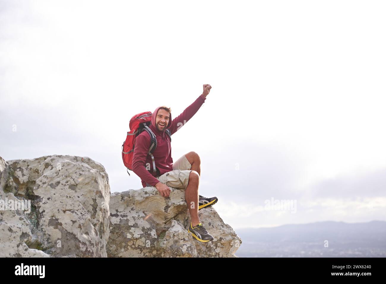 Happiness, mountain and man with celebration for hiking, peak and ...