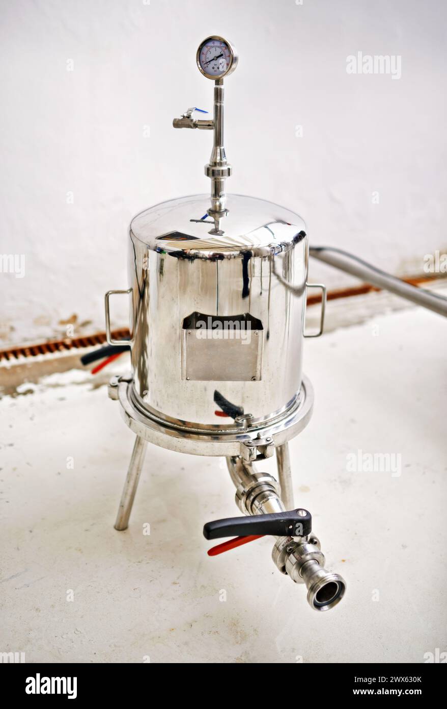 Brewery, production and temperature with steel in factory or distillery ...