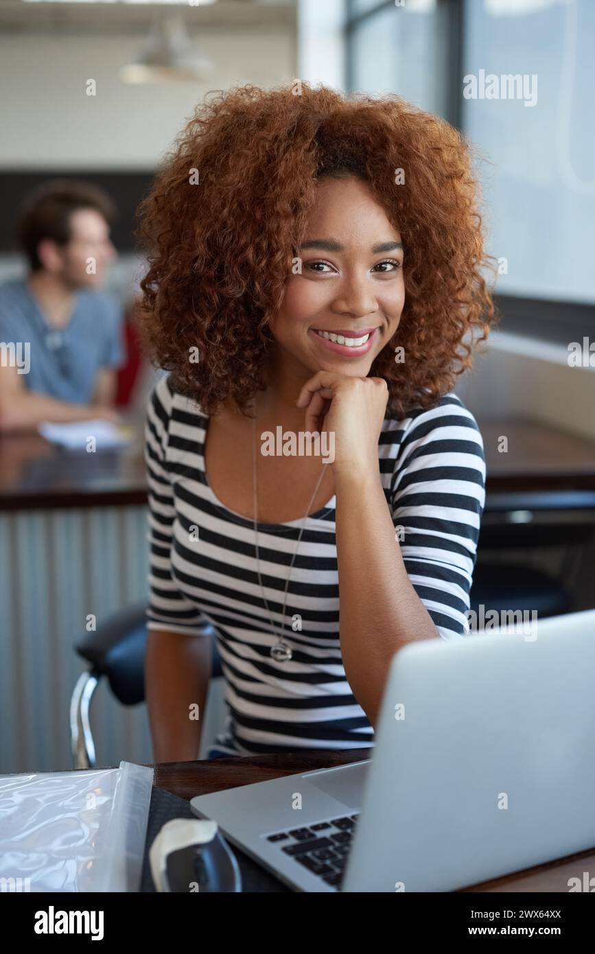 Portrait, smile and black woman with laptop in office, workspace and ...