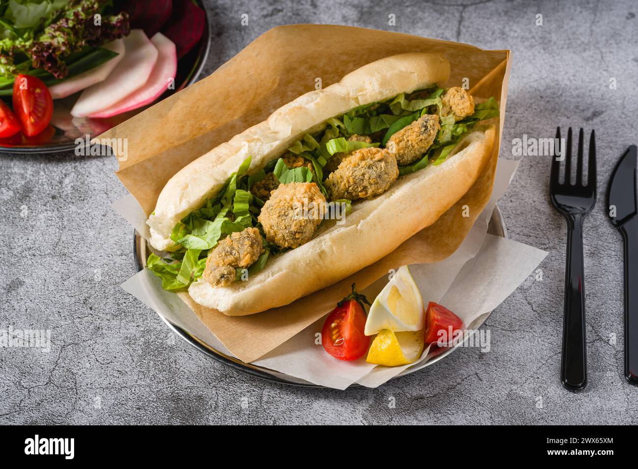 Deep fried mussels in bread and with greens on the side. Turkish name ...