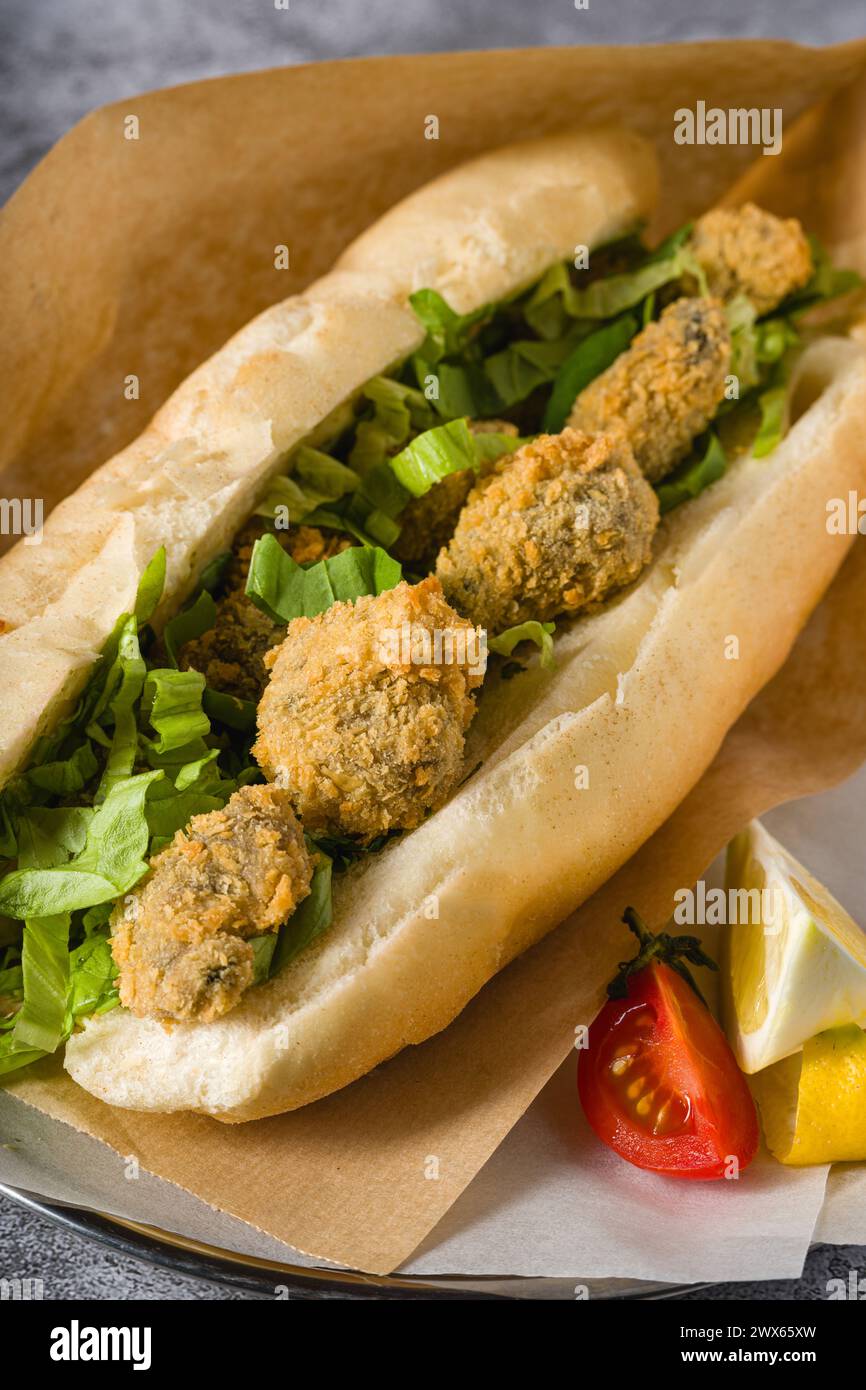 Deep fried mussels in bread and with greens on the side. Turkish name ...