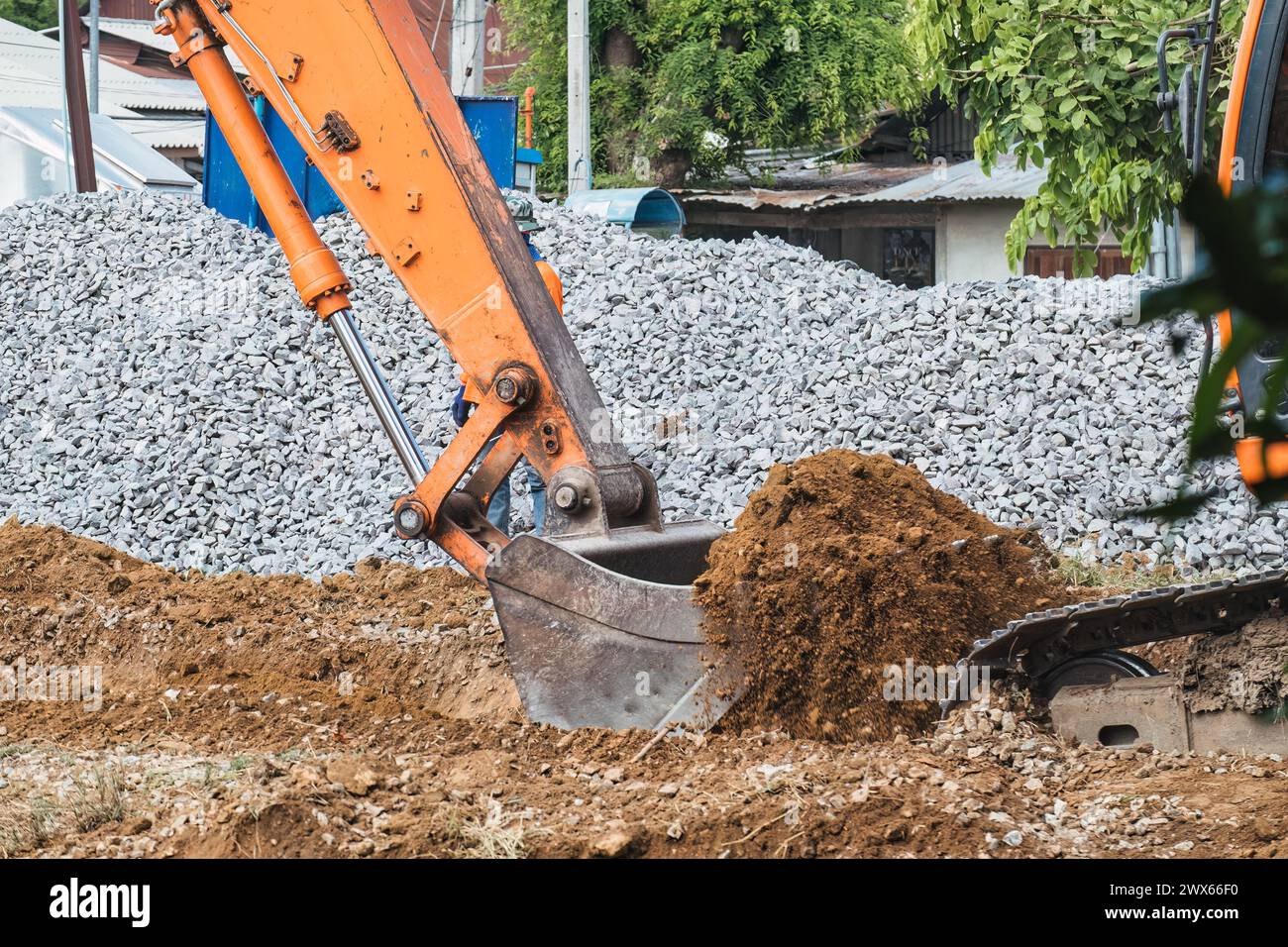 Excavator or backhoe scoop earth moving and digging soil and stone on ...