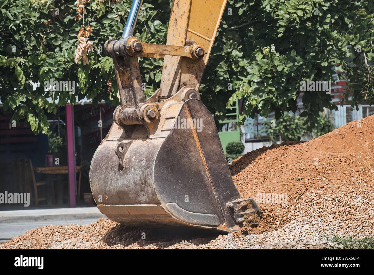 Excavator or backhoe scoop earth moving and digging soil and stone on ...