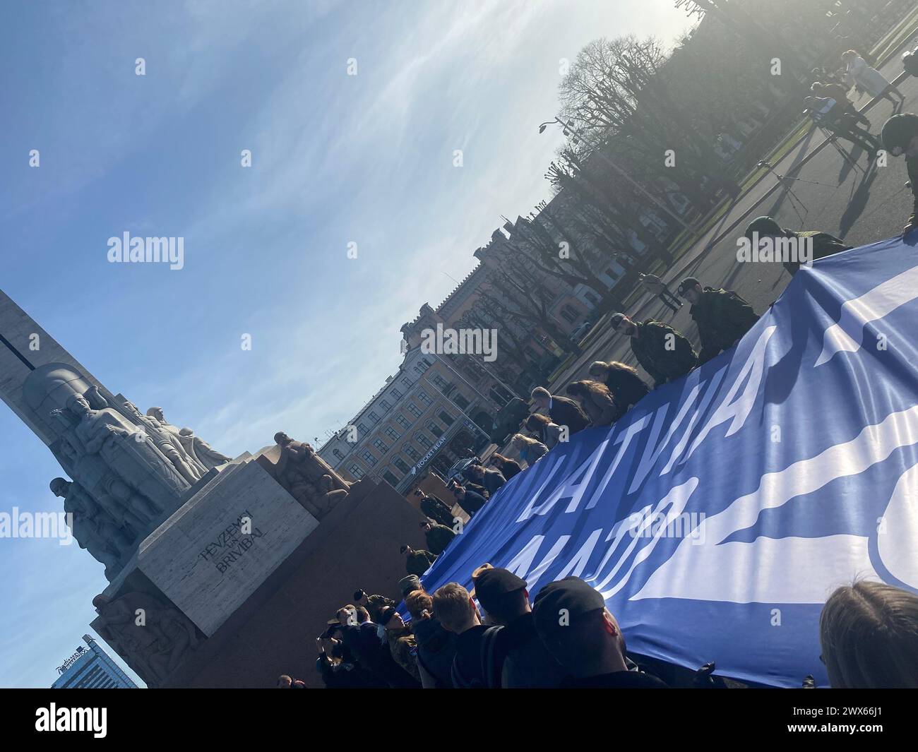 Riga, Latvia. 28th Mar, 2024. A huge blue flag with the inscription ...