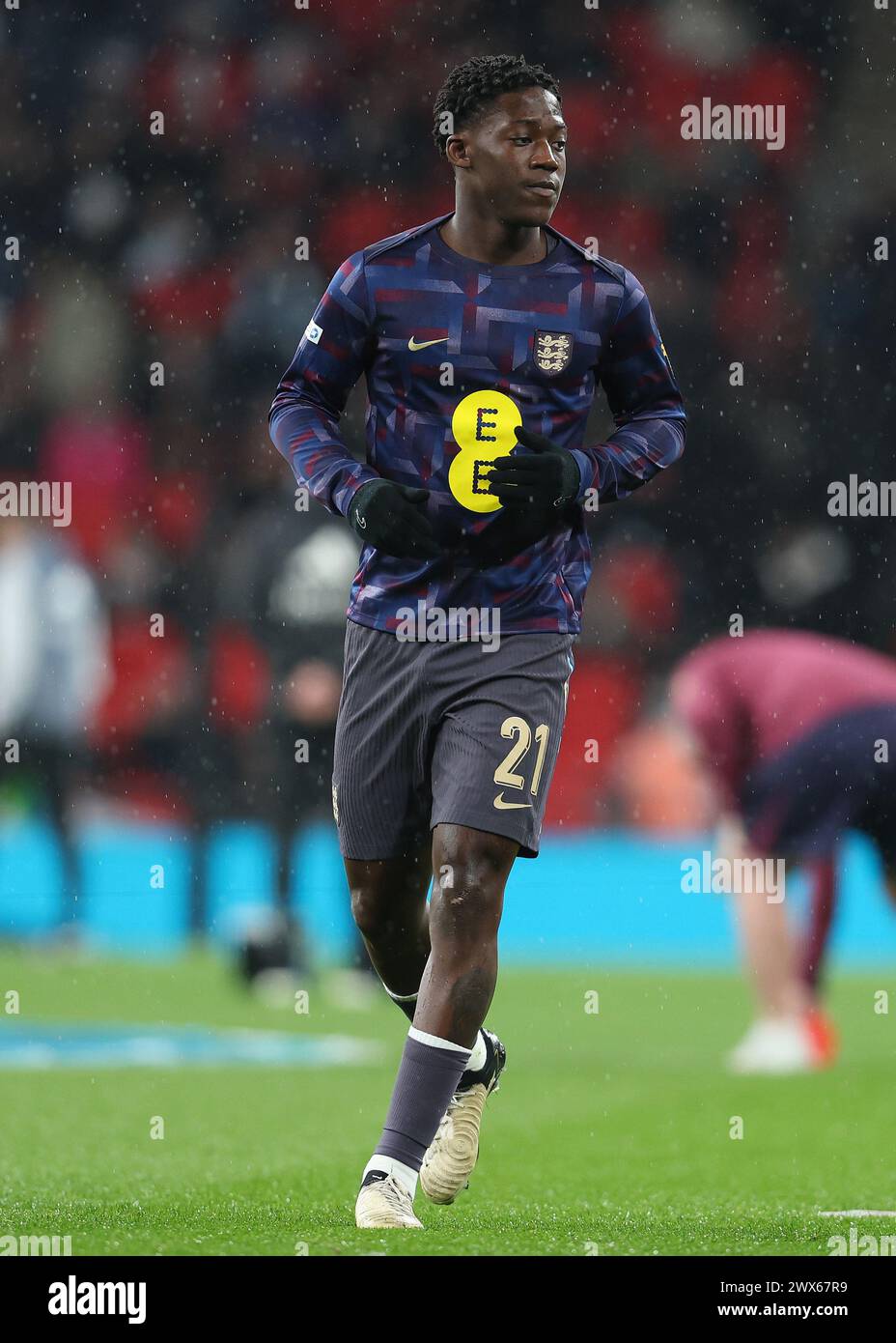 London, UK. 26th Mar, 2024. Kobbie Mainoo of England warms up during ...