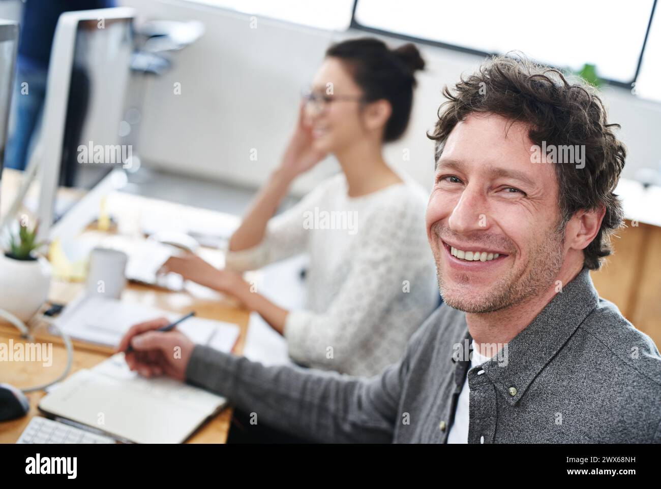 Portrait, man and teamwork in office for planning with monitor ...