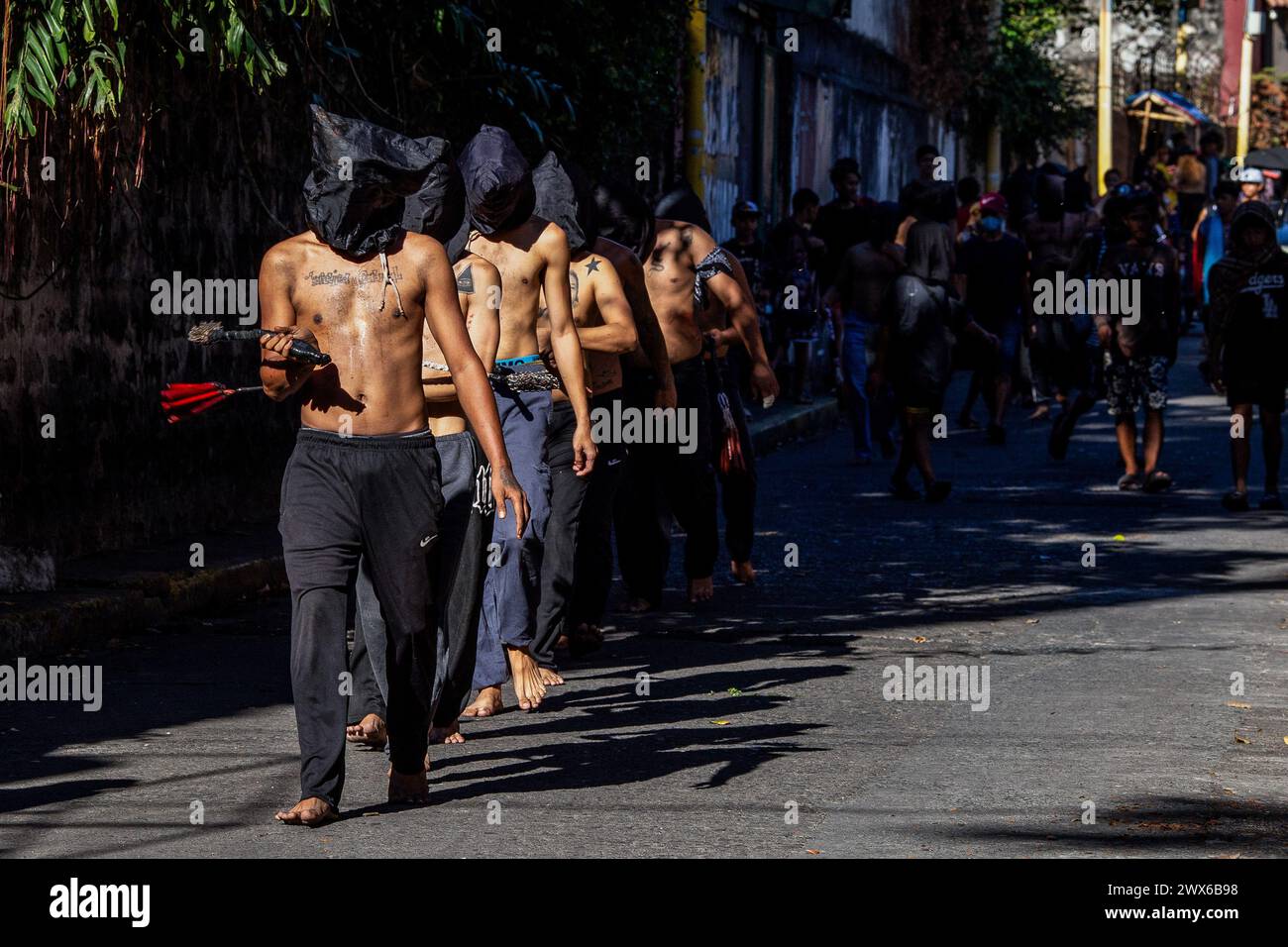 Mandaluyong City, Philippines. 28th Mar, 2024. Filipino flagellants ...