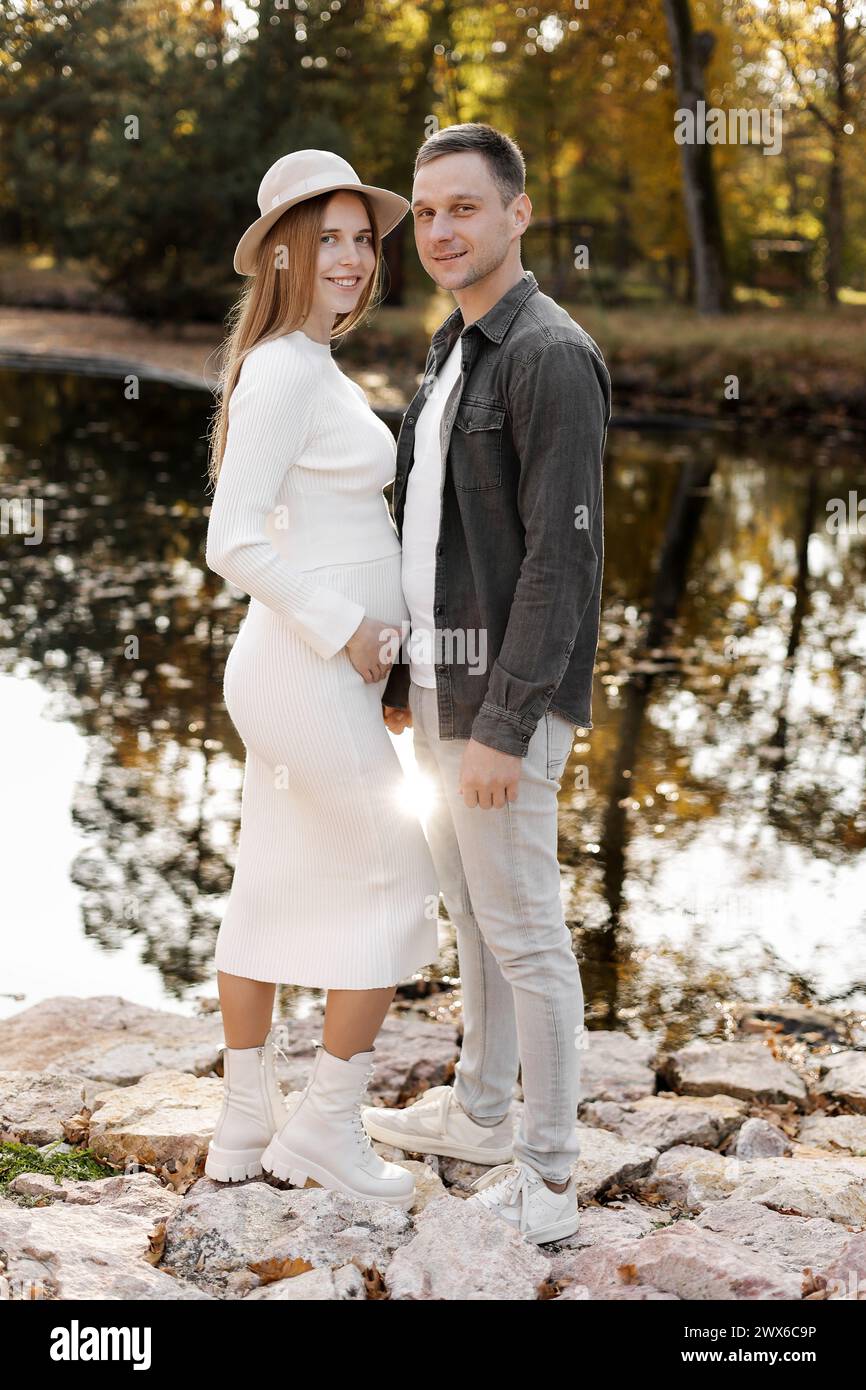 Family day. Stylish marriage pregnant couple waiting for baby. Man is ...