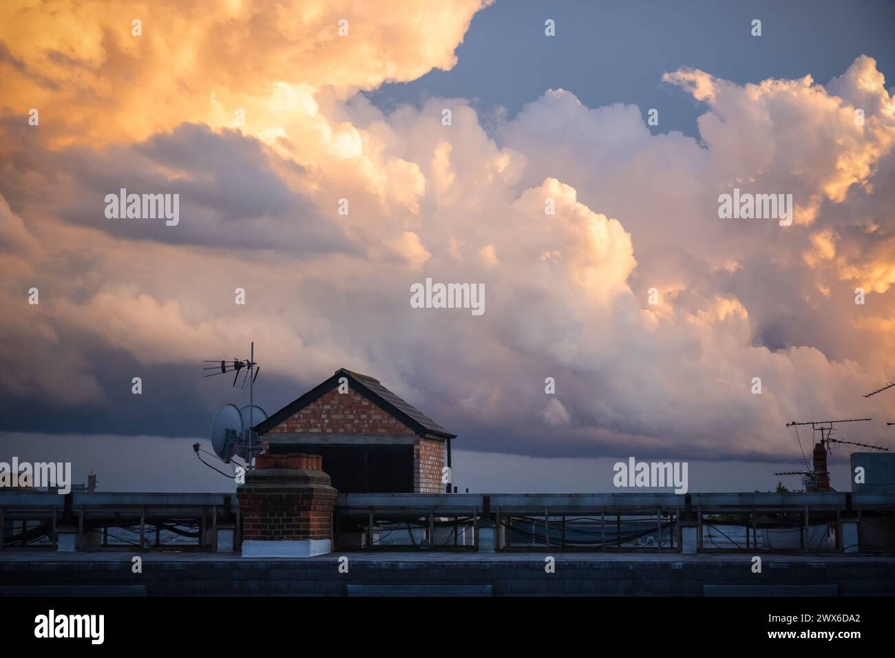 Cloudscape photography, fluffy clouds coloured with sunset light in London Stock Photo - Alamy
