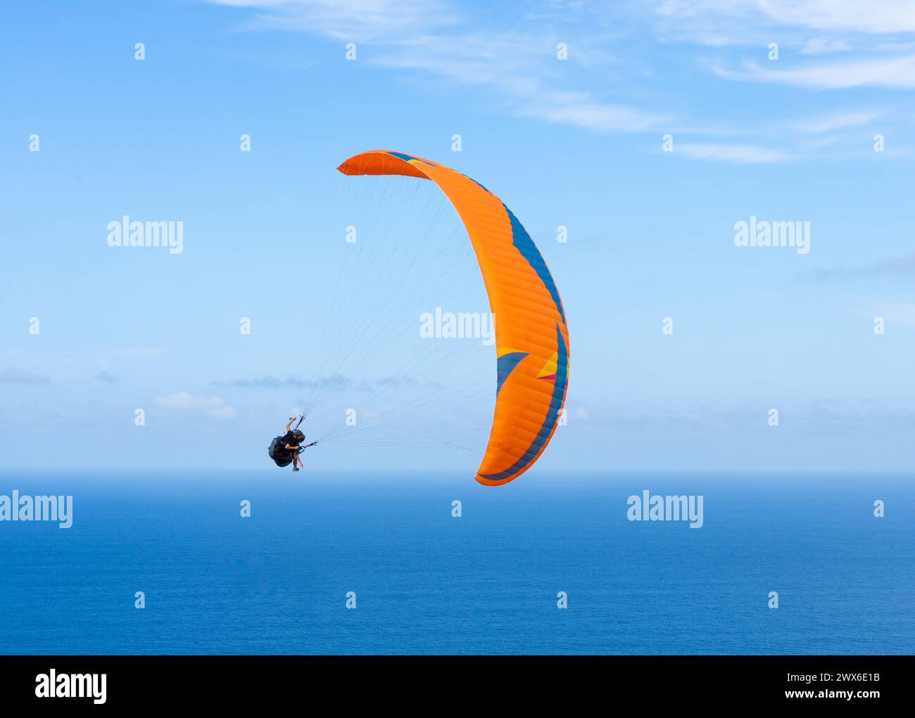 Paragliding flying with two people over the sea with copy space Stock ...