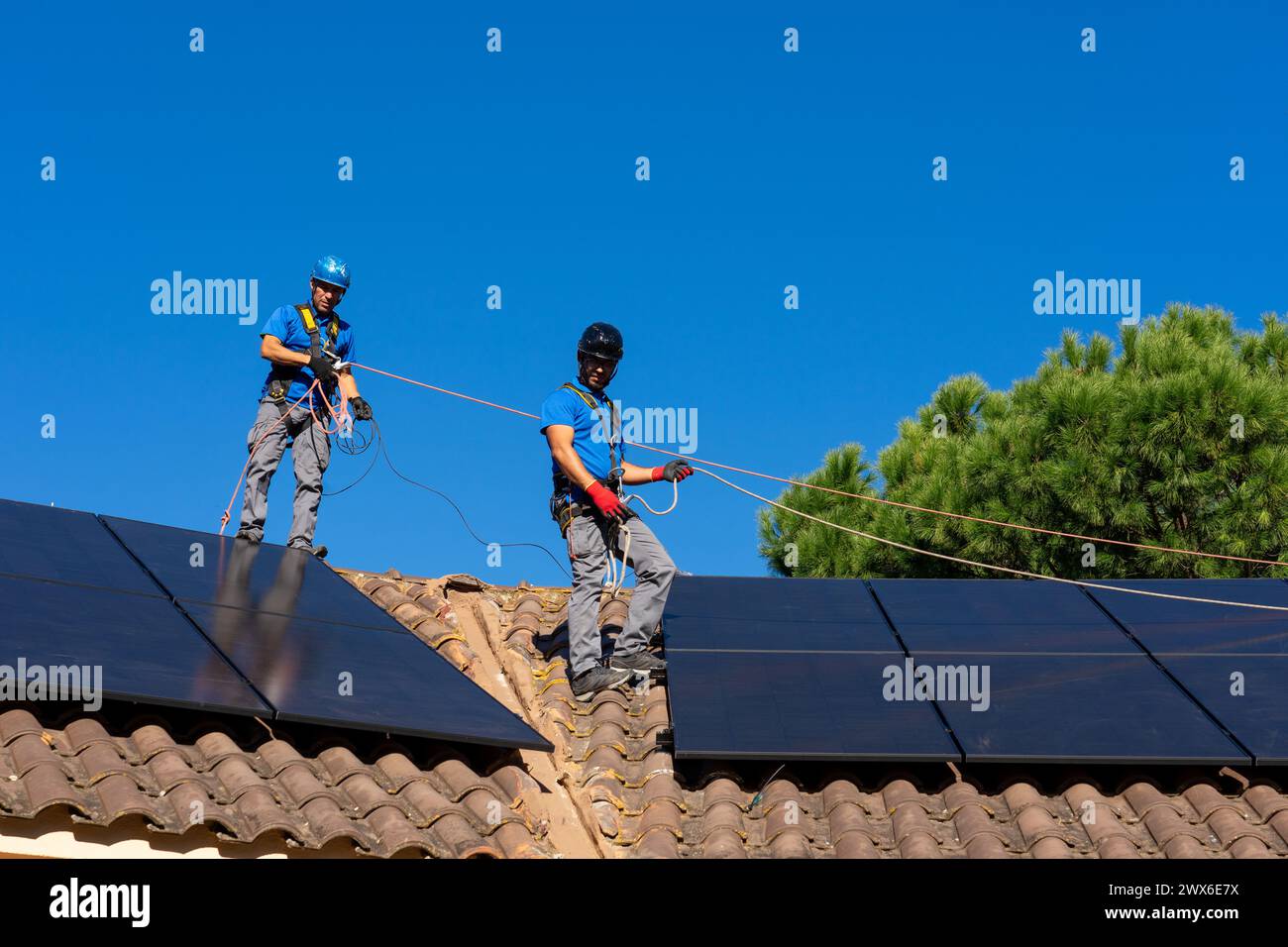 Technicians installing solar panel system hi-res stock photography and ...