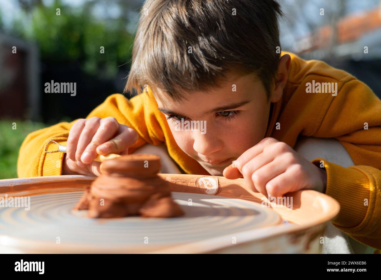 Child exploring ceramics hi-res stock photography and images - Alamy