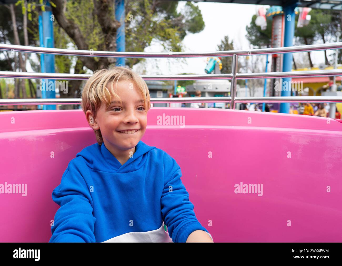 Happy child at the amusement park Stock Photo - Alamy