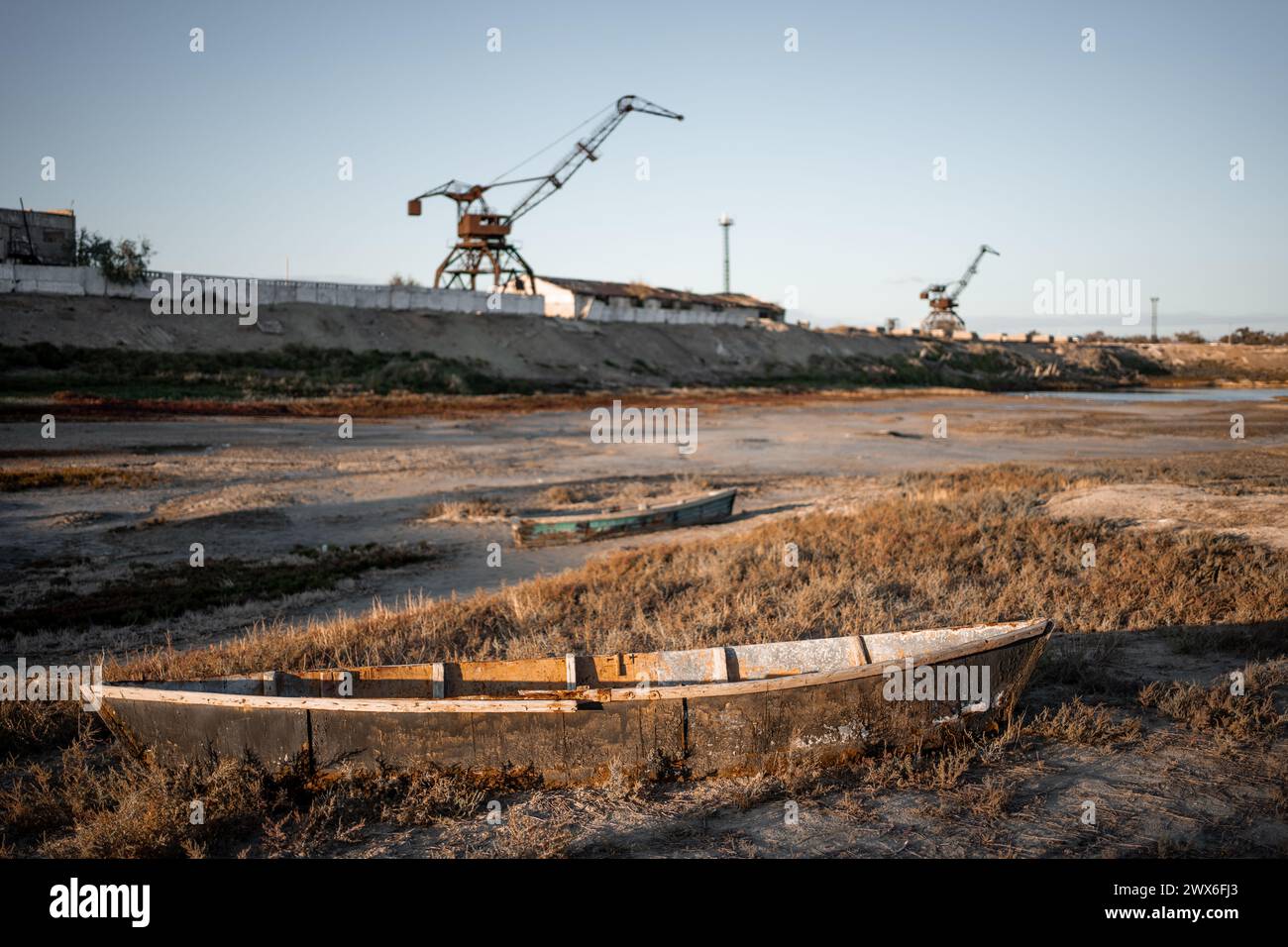 A lone fishing boat rests in the abandoned harbor of Aralsk, Kazakhstan ...