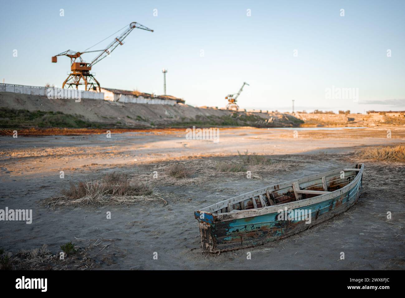 A lone fishing boat rests in the abandoned harbor of Aralsk, Kazakhstan ...