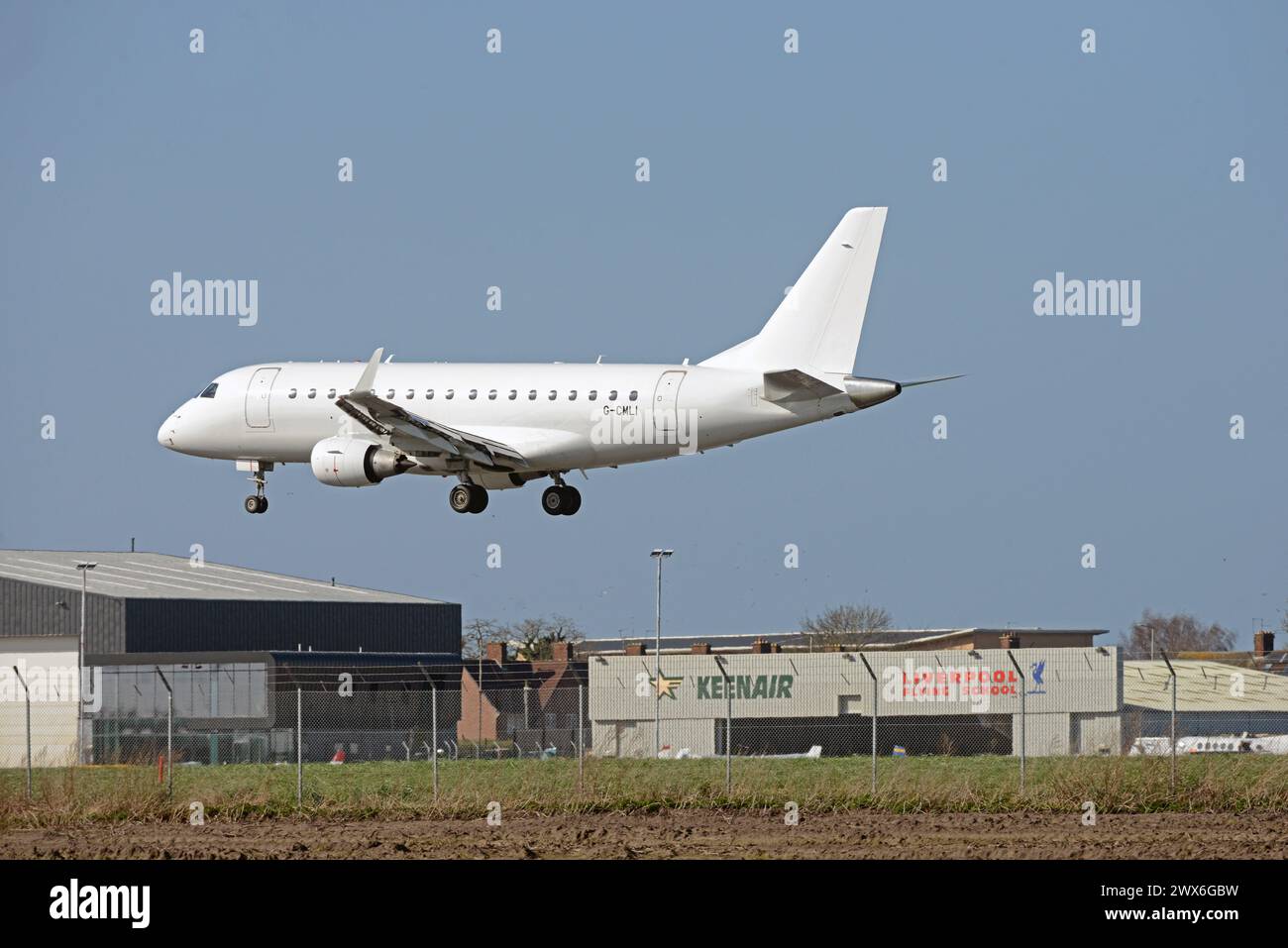 EASTERN AIRWAYS EMBRAER E-190 G-CMLI approaching runway 27 at LIVERPOOL JOHN LENNON AIRPORT ...