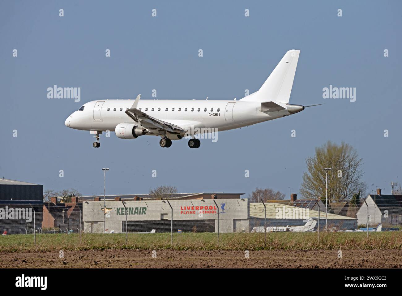 EASTERN AIRWAYS EMBRAER E-190 G-CMLI approaching runway 27 at LIVERPOOL ...