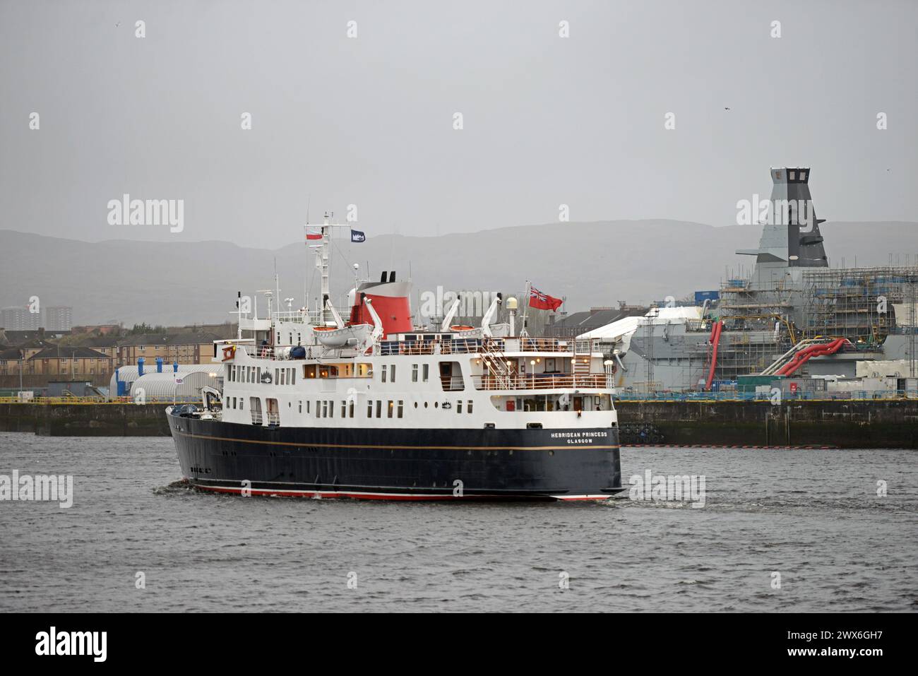 HEBRIDEAN PRINCESS downriver in the RIVER CLYDE passing HMS GLASGOW ...