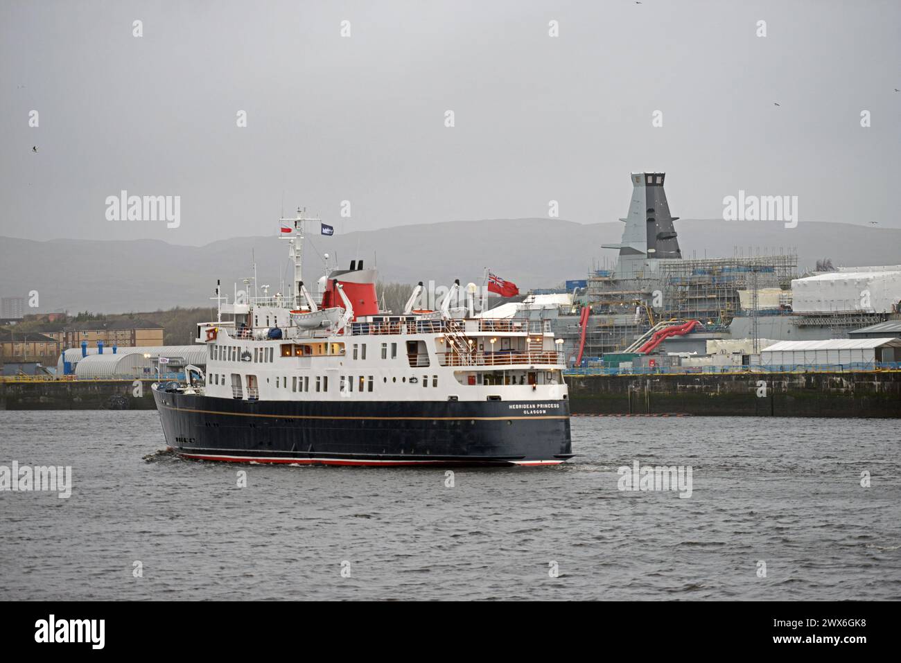 HEBRIDEAN PRINCESS downriver in the RIVER CLYDE passing HMS GLASGOW ...
