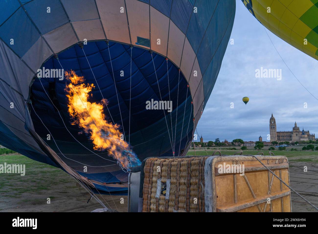 Hot air balloon with fire flame preparing to fly Stock Photo - Alamy