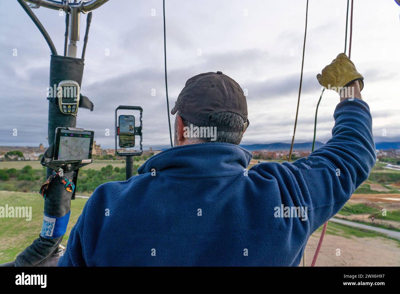 Hot air balloon pilot flying Stock Photo - Alamy