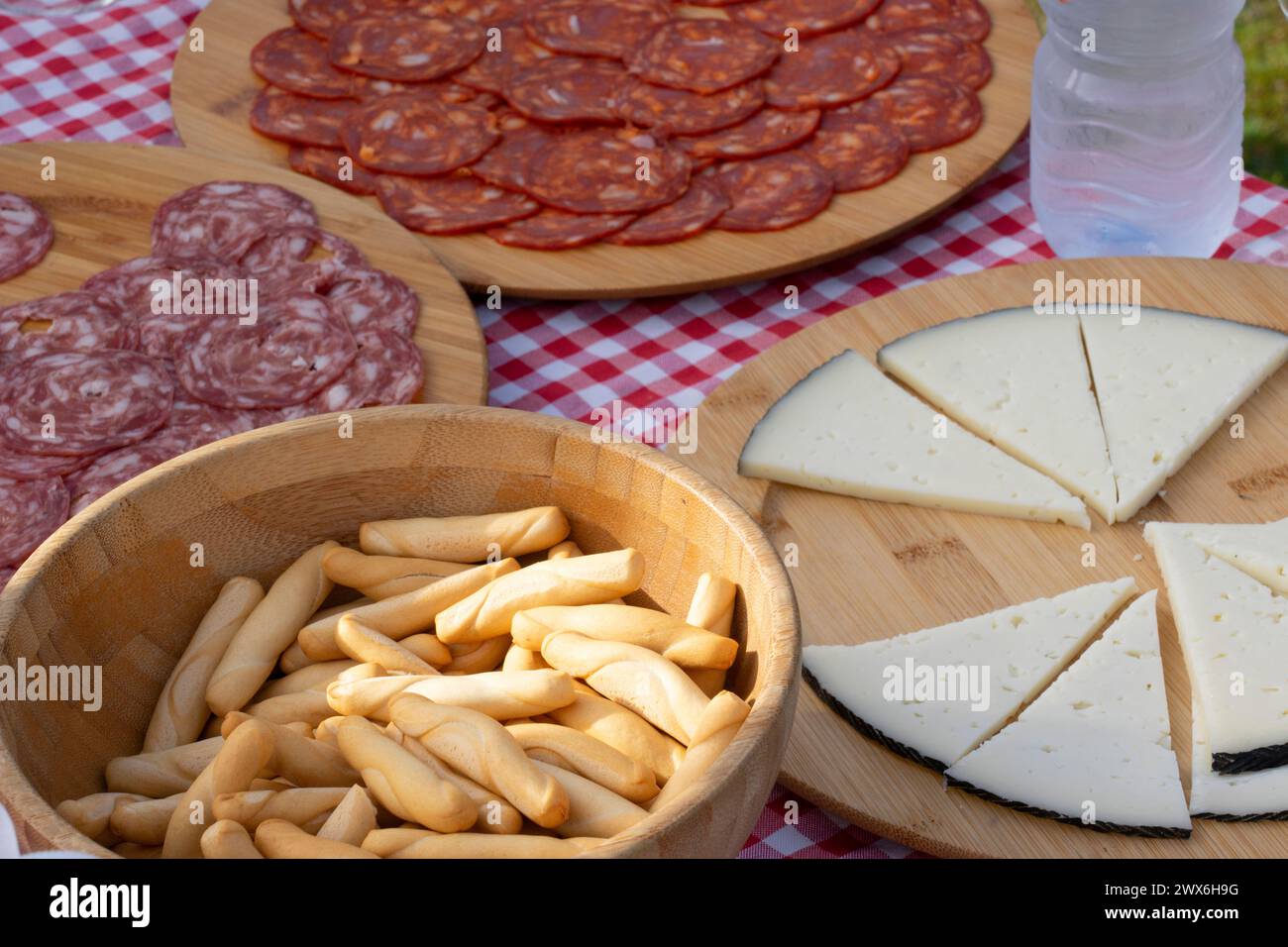 Typical Spanish appetizer in the outdoor field. Picnic with cheese ...