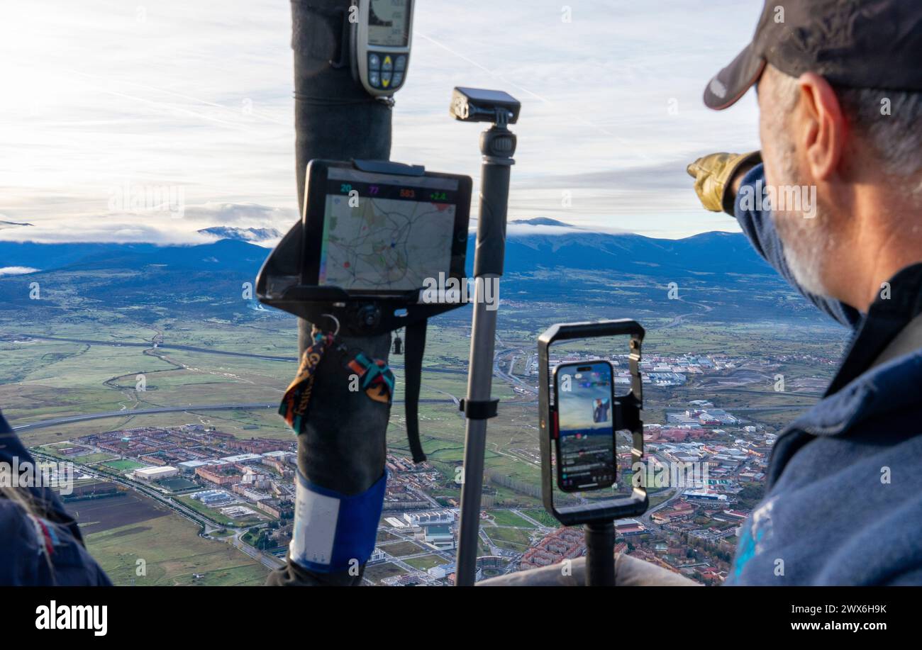 Hot air balloon pilot pointing to the horizon while flying Stock Photo ...