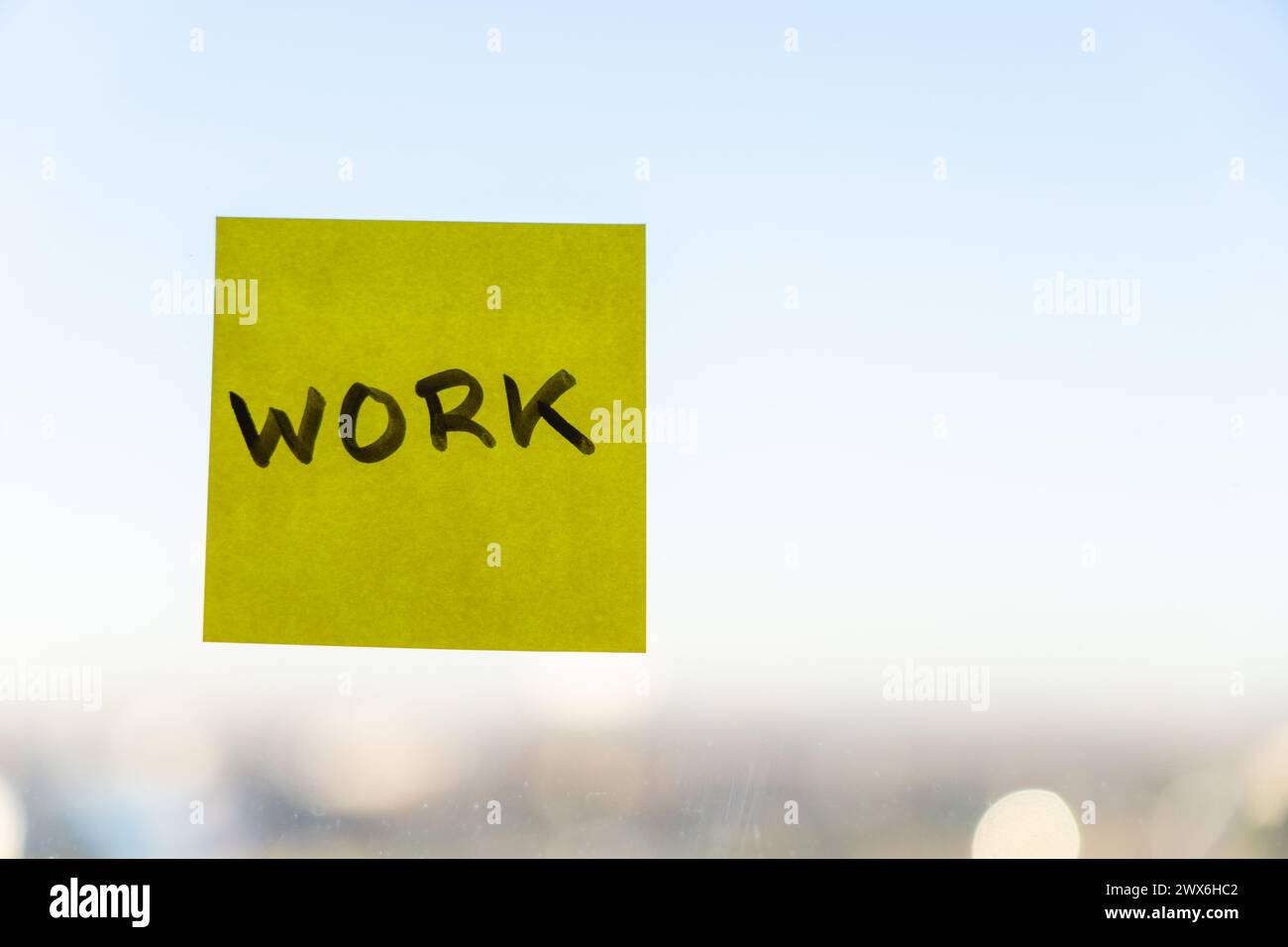 Post it with the word work Stock Photo - Alamy
