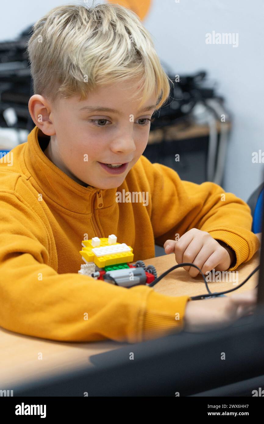 Boy learning robotics with a computer Stock Photo - Alamy