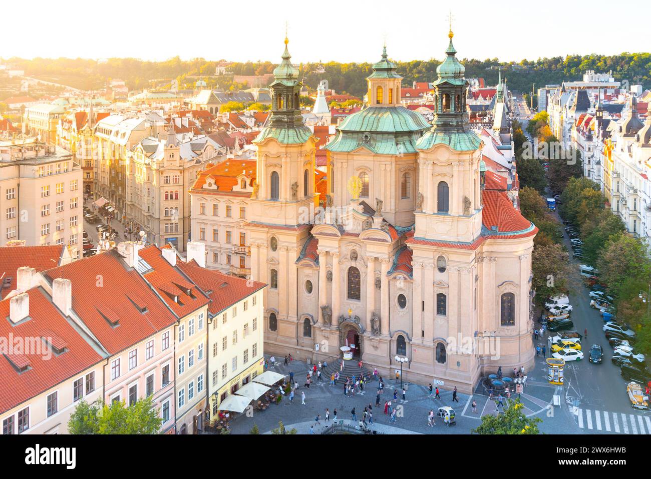 The golden sunlight bathes the Church of Saint Nicholas and surrounds ...