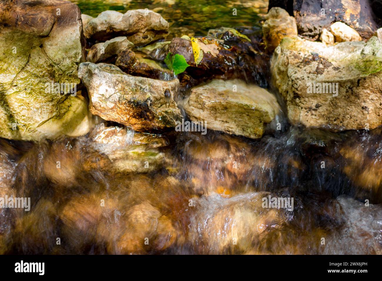 Water over stones hi-res stock photography and images - Alamy