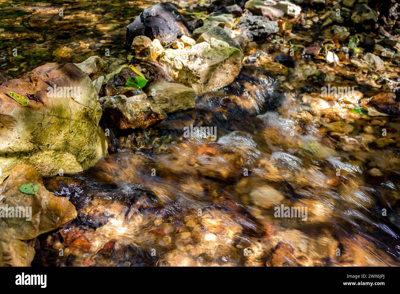 Water over stones hi-res stock photography and images - Alamy