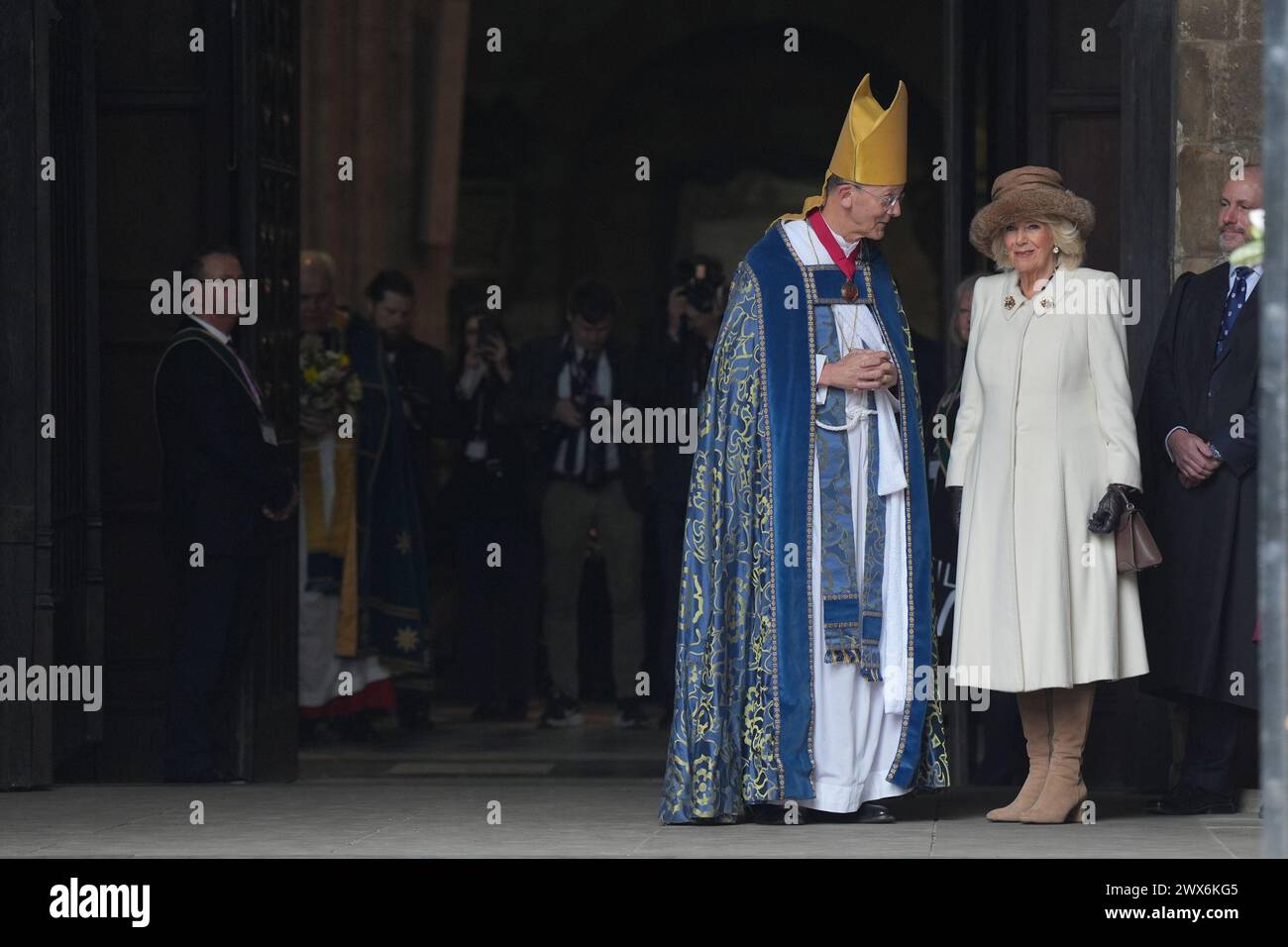 Queen Camilla is greeted by the Bishop of Worcester, John Inge, as she ...