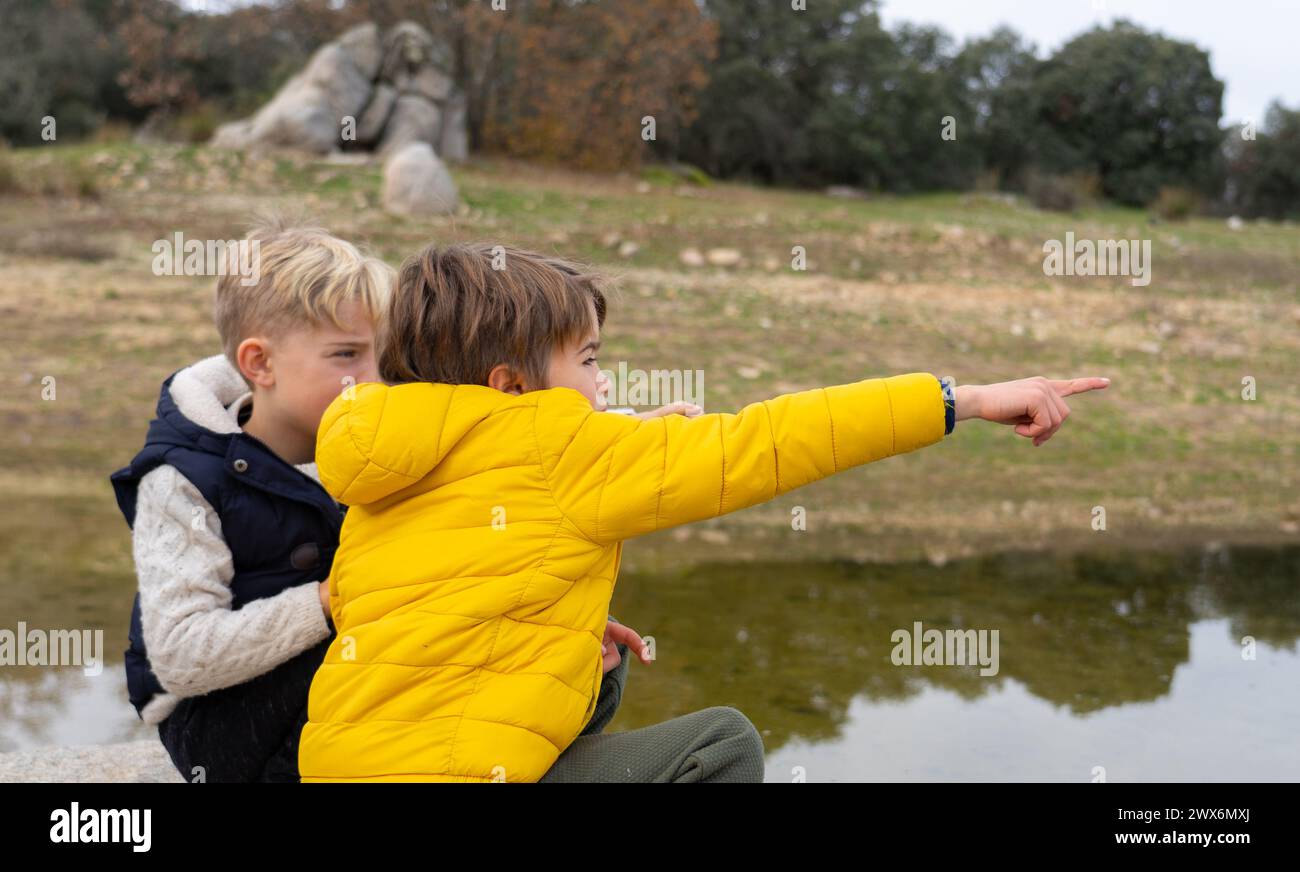 Children observing nature in a lake Stock Photo - Alamy