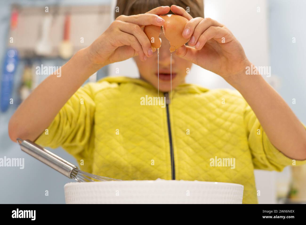 Child cracking egg hi-res stock photography and images - Alamy