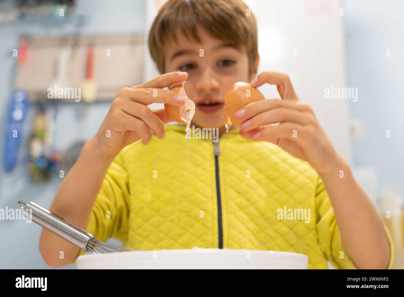 Child cracking egg hi-res stock photography and images - Alamy