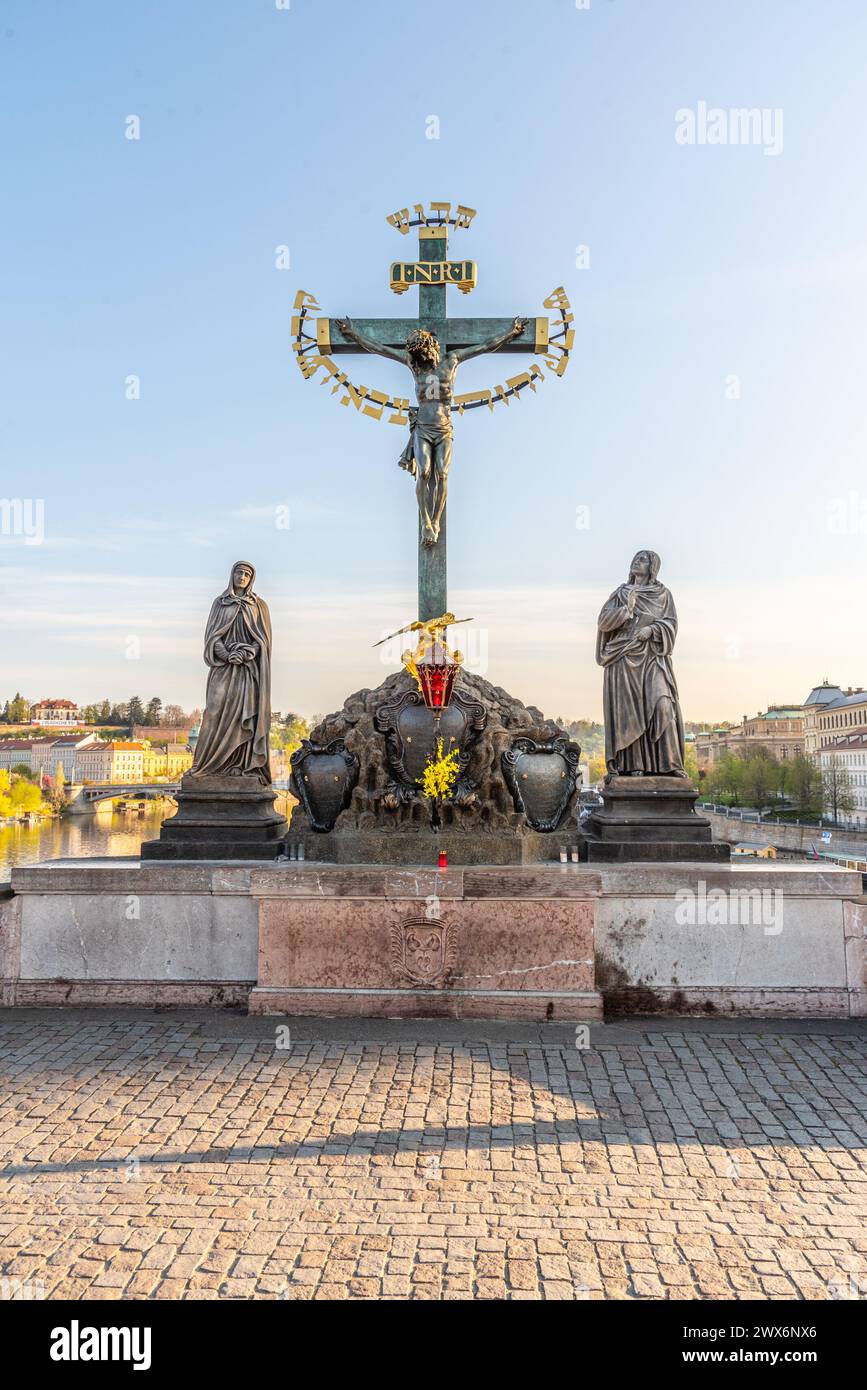 The Jesus cross sculpture stands prominently on Charles Bridge in ...