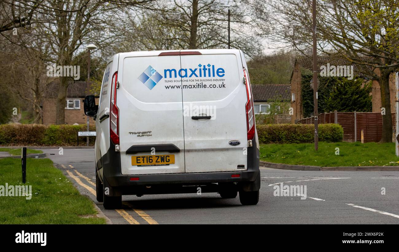 Milton Keynes,UK-Mar 26th 2024:White Ford transit van parked on double ...