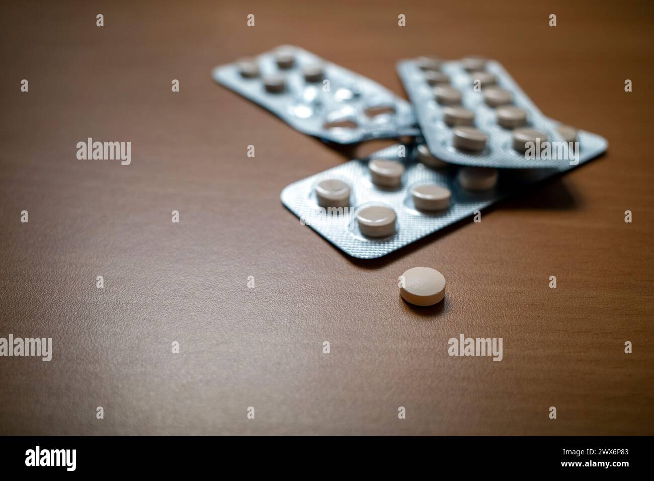 Cream tablets pills drugs on wooden table. Medicine concept Stock Photo ...